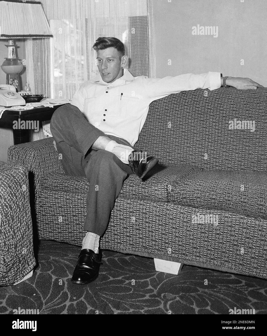 William Girard, 22, relaxes while watching television at his Ottawa ...