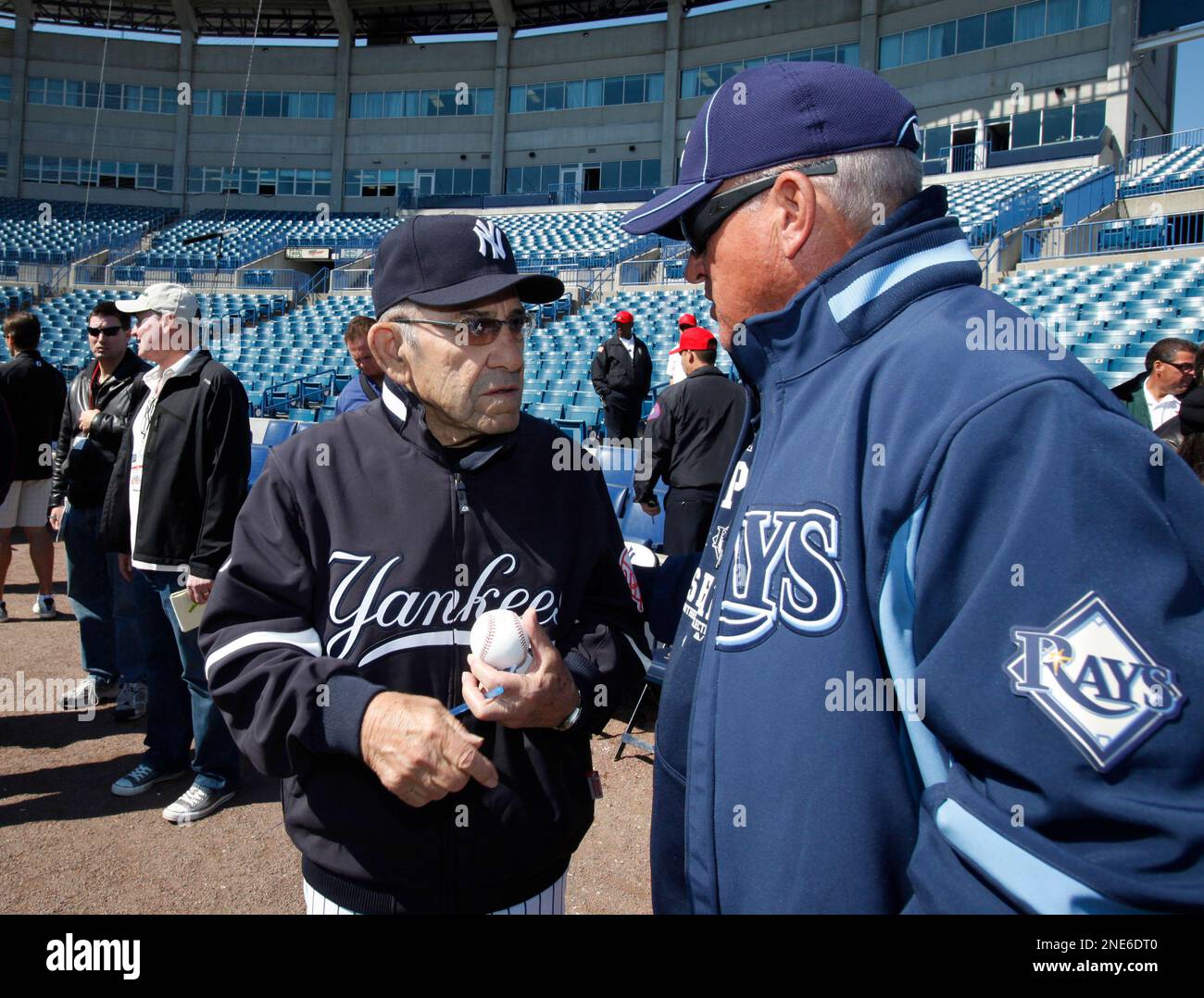 New York Yankees Hall of Fame catcher Yogi Berra, left, chats with ...