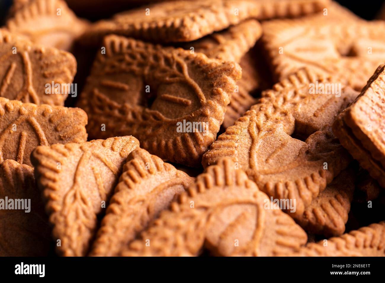 A pile of multiple brown cookies called speculoos or speculaas in ...