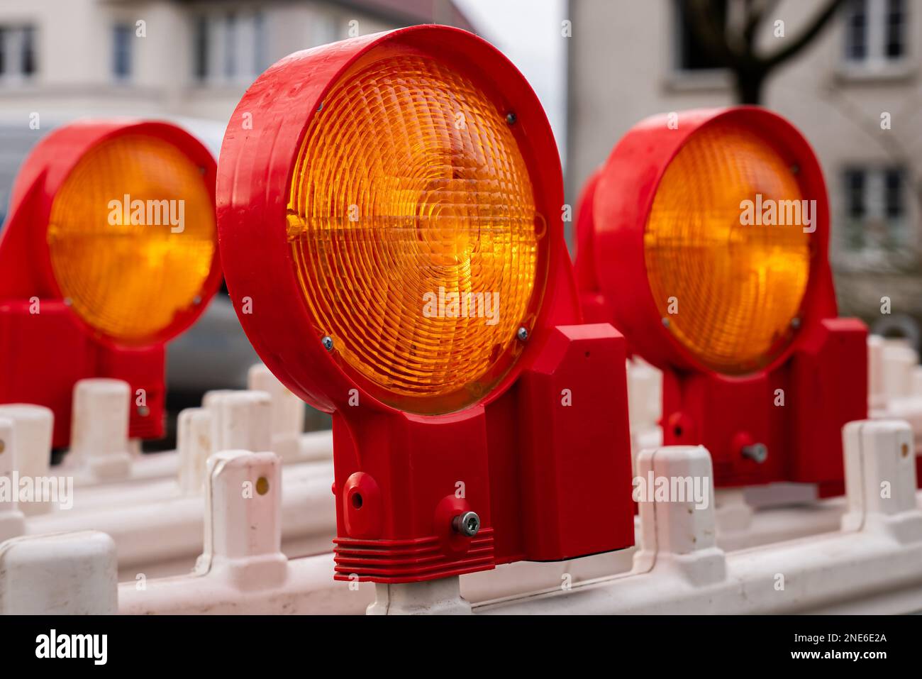 Orange-red signal lights of the road barrier. Close-up Stock Photo - Alamy