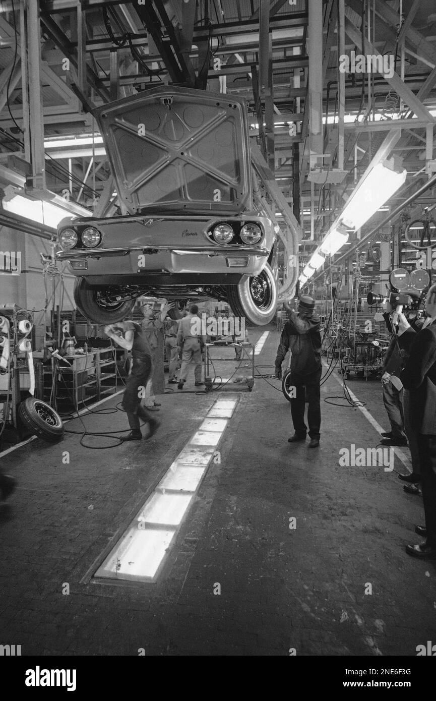 Workmen at Chevrolet's Willow Run plant finish assembling the last ...