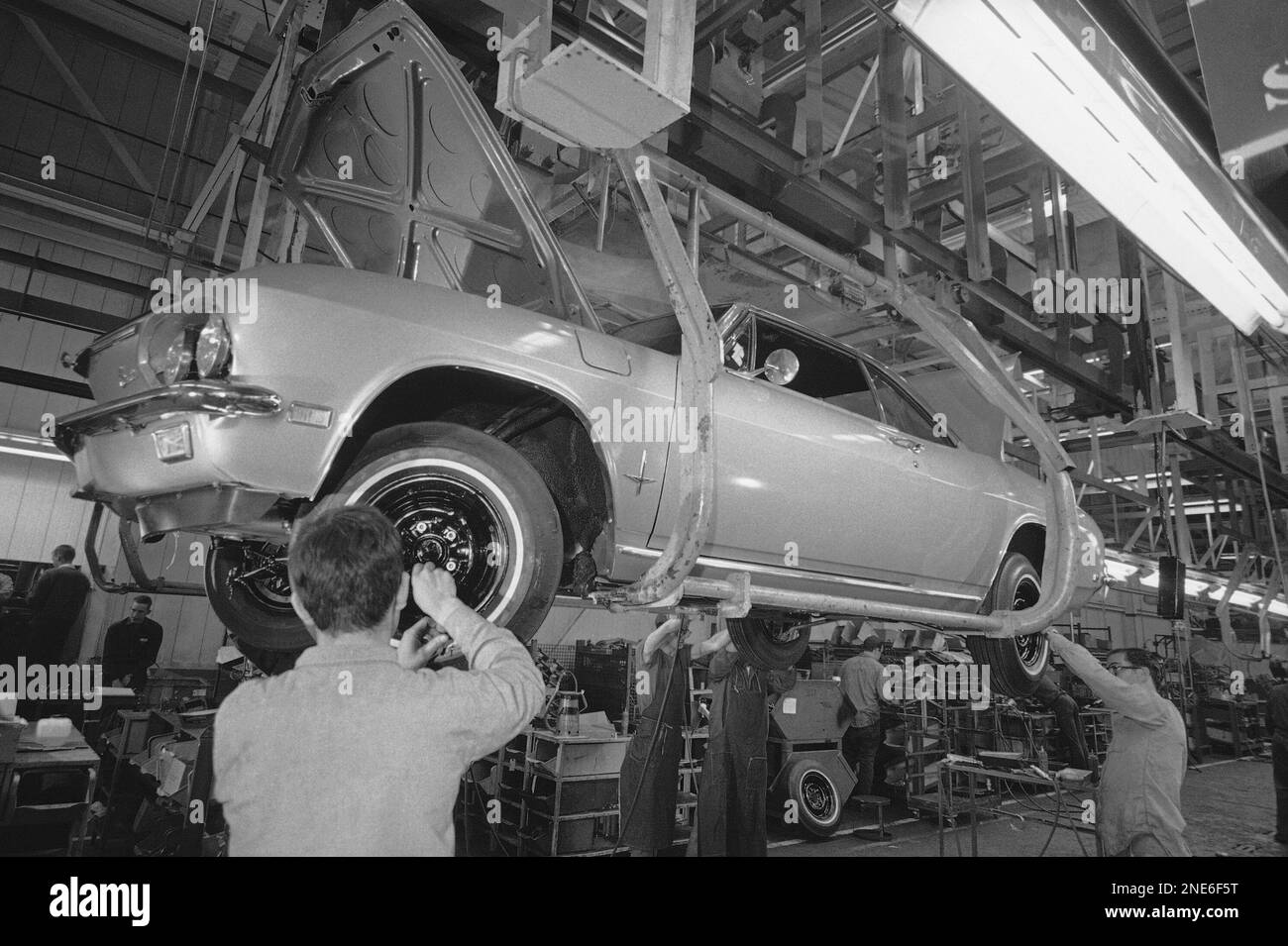 Workmen at Chevrolet's Willow Run plant finish assembling the last ...