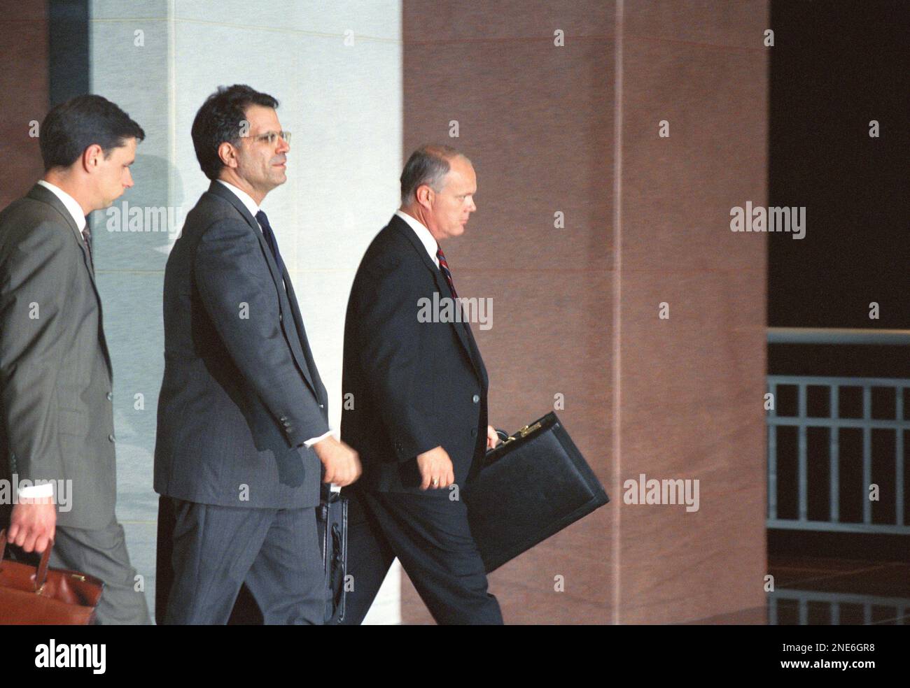 Walking holding hands looking away authority hi-res stock photography ...