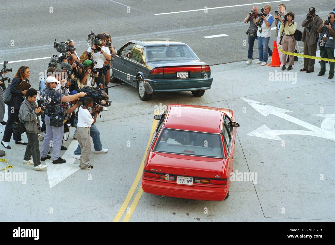The media converge on a car carrying defendants Stacey Koon and Timothy ...