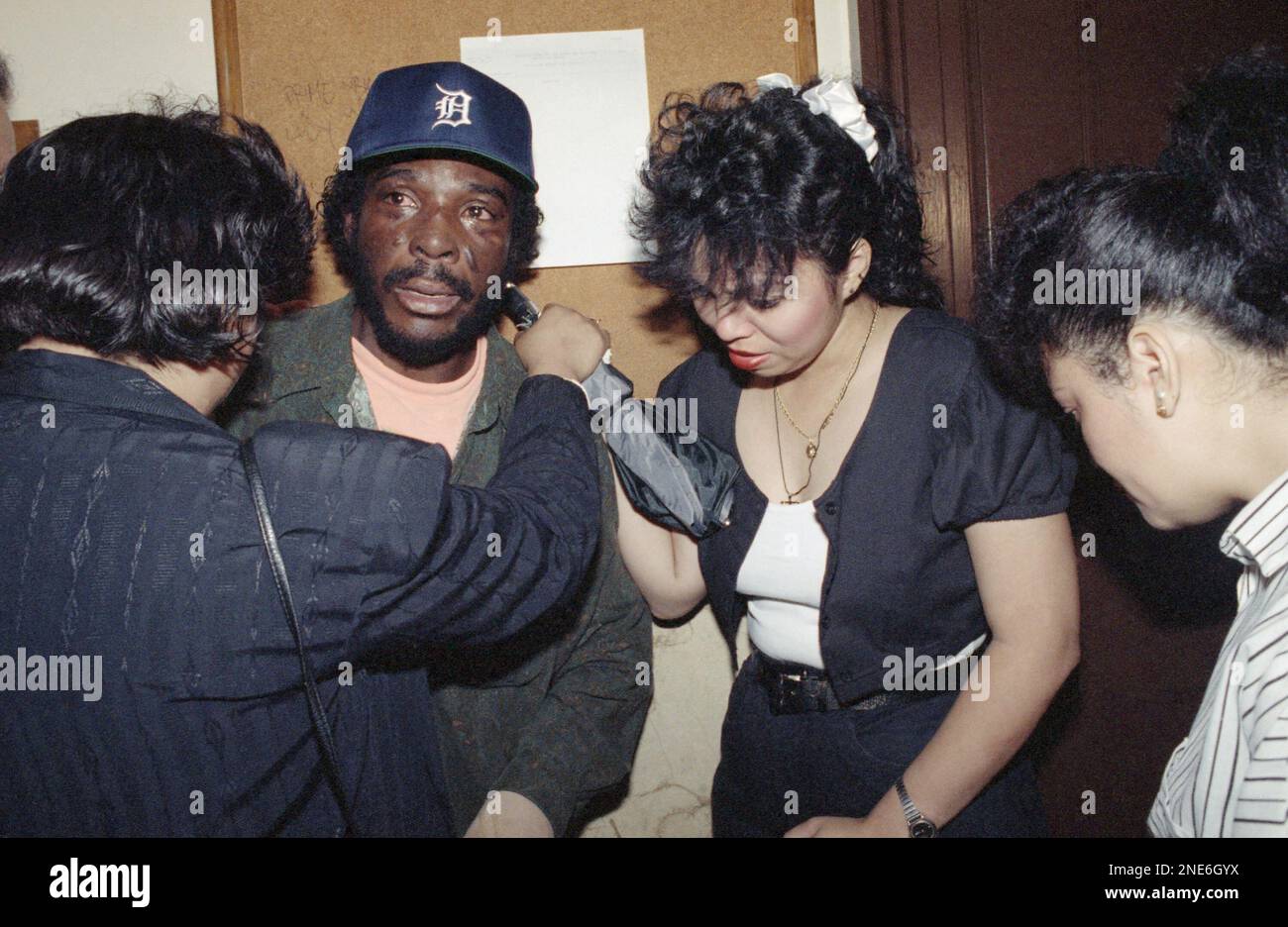 Reuben Valladares, second from left, is consoled by Isabel Gamoneda ...