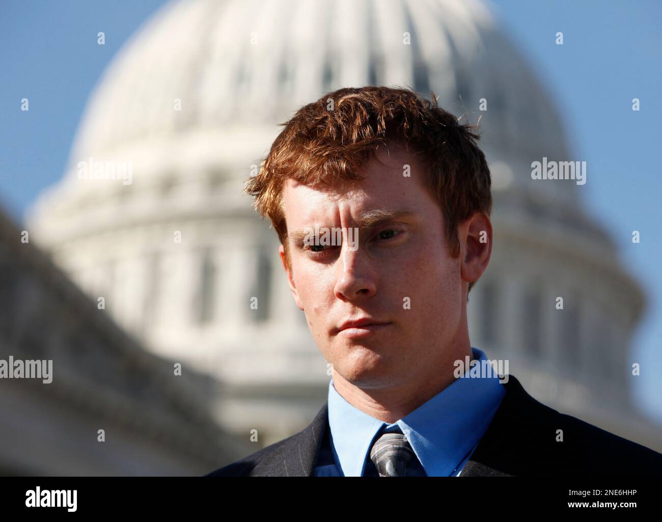 Accused Navy SEAL Matthew McCabe listens as Reps. Dana Rohrabacher,R ...