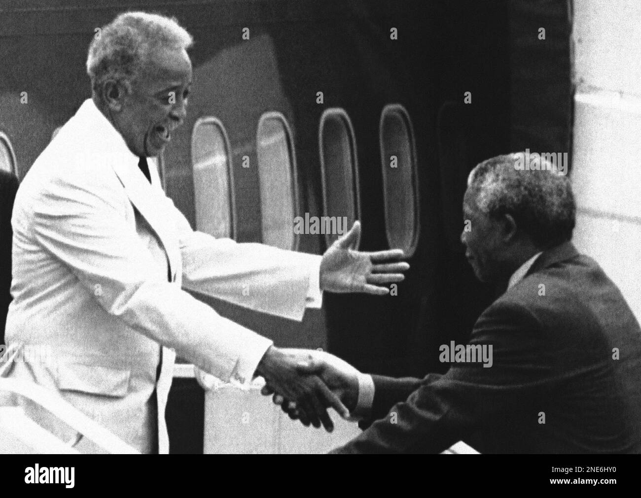 New York City Mayor David Dinkins, left, is welcomed by African National Congress President ...