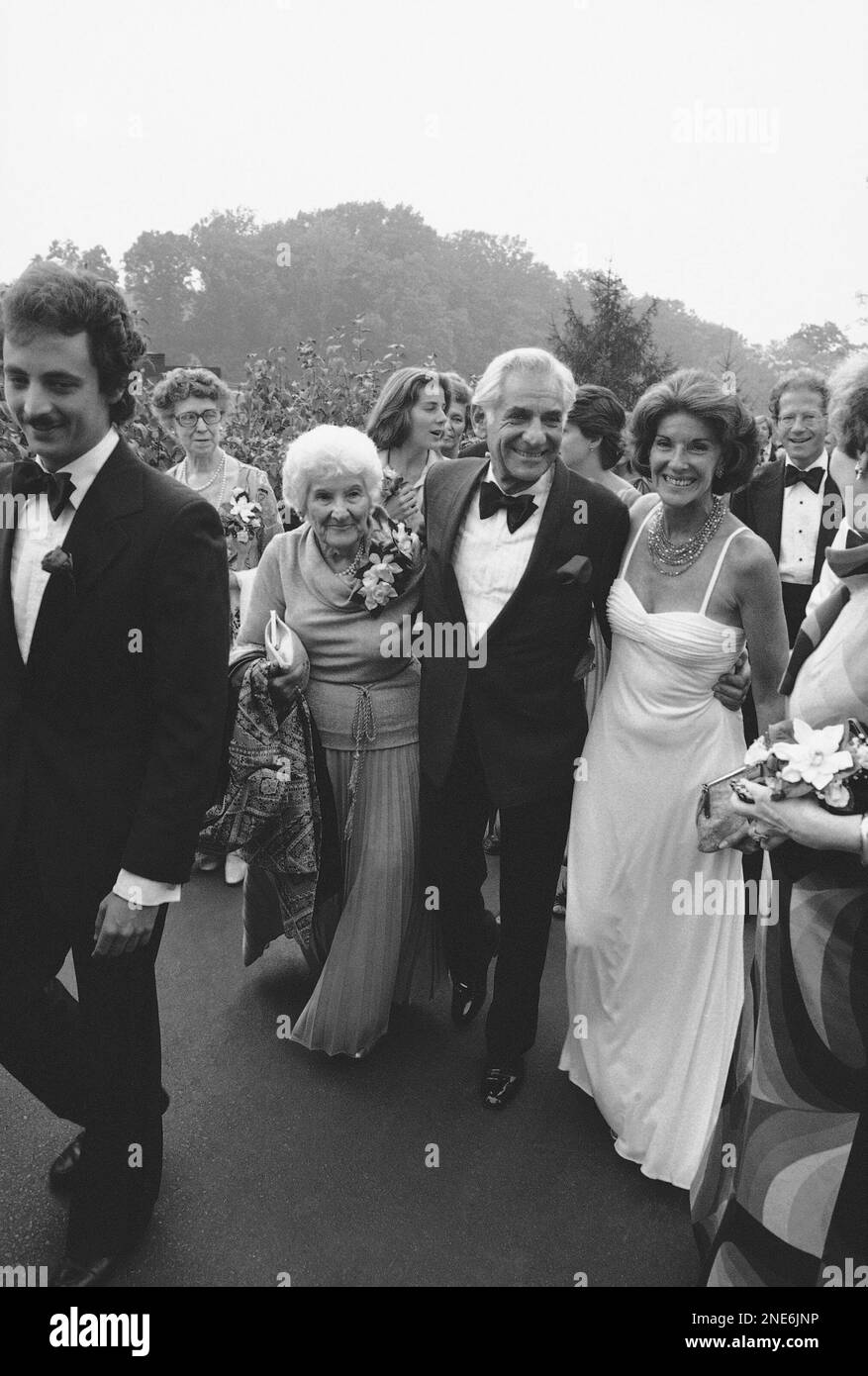 Leonard Bernstein, center, is flanked by his mother Jonnie Bernstein ...