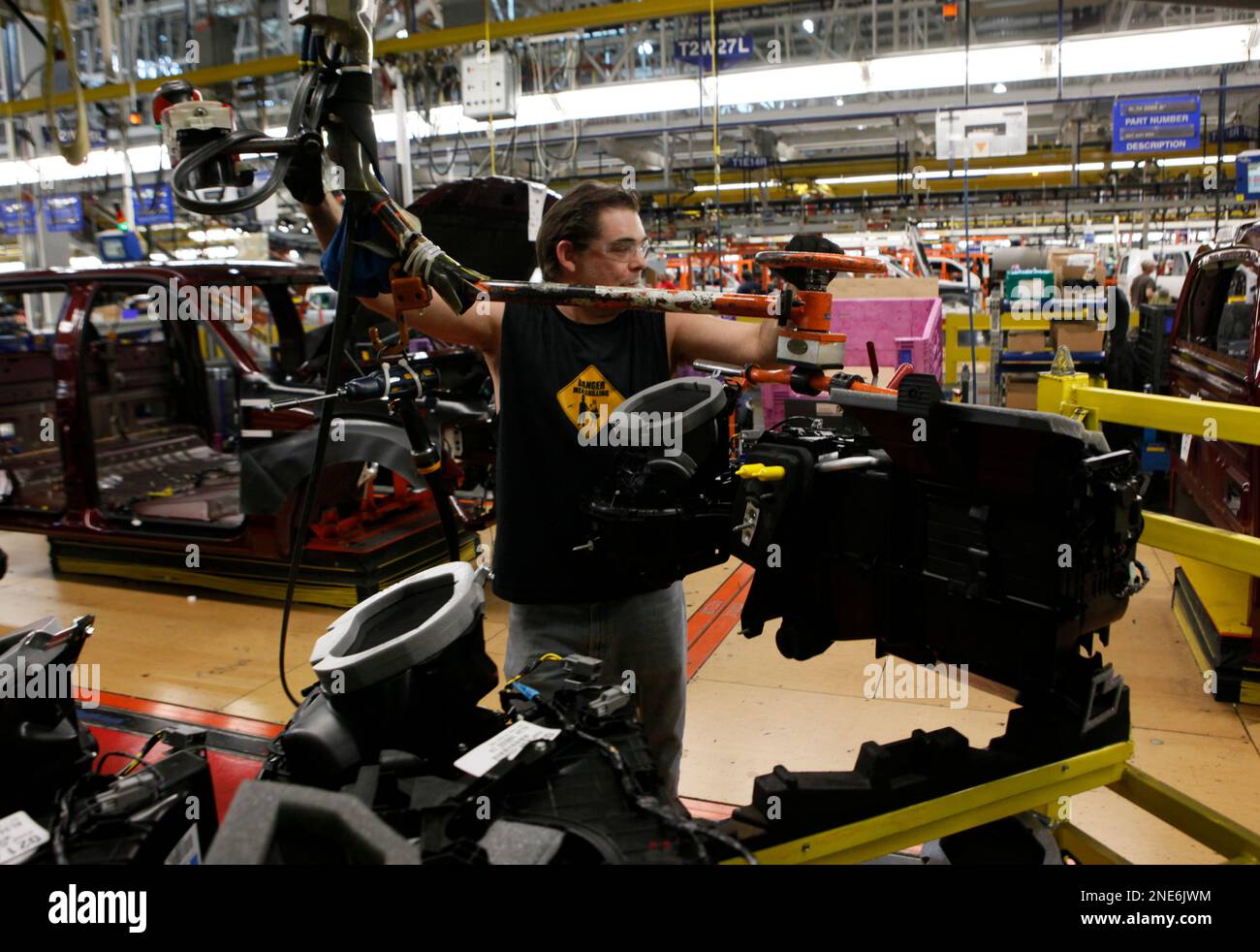 Auto workers work on the assembly line at the Ford Dearborn Truck Plant ...