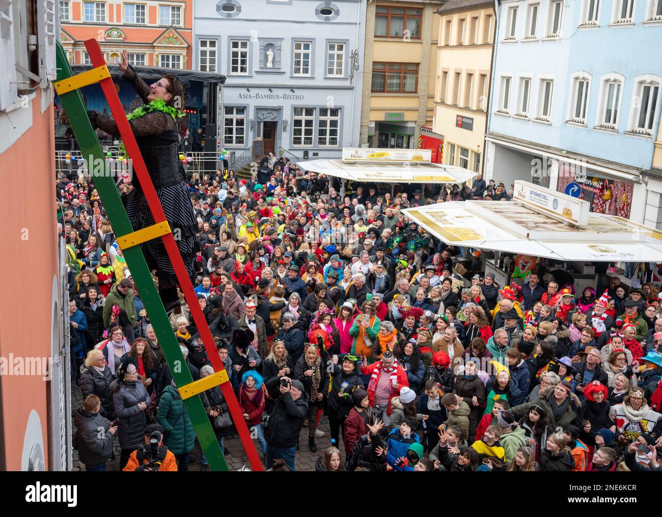 Wittlich, Germany. 16th Feb, 2023. A carnival woman climbs a ladder on ...