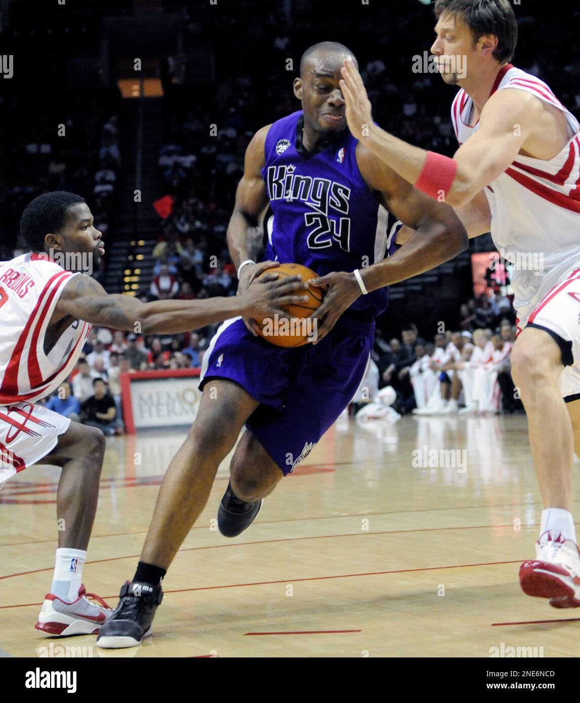 Houston Rockets' Aaron Brooks, left, and David Andersen, right, from ...