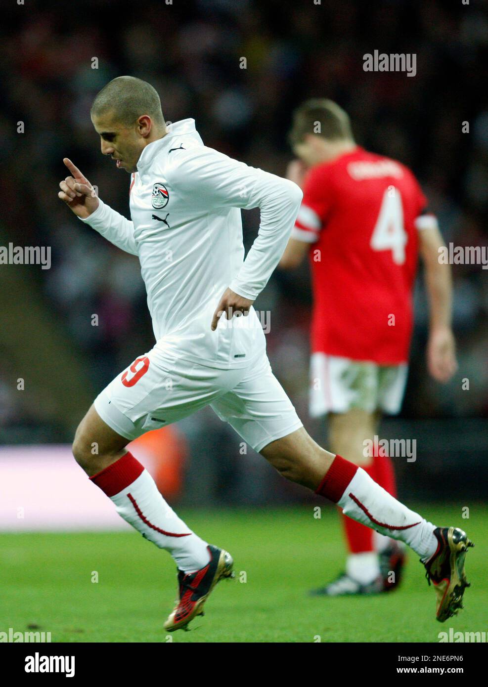 Egypt's Mohamed Zidan, left, celebrates his goal against England during ...