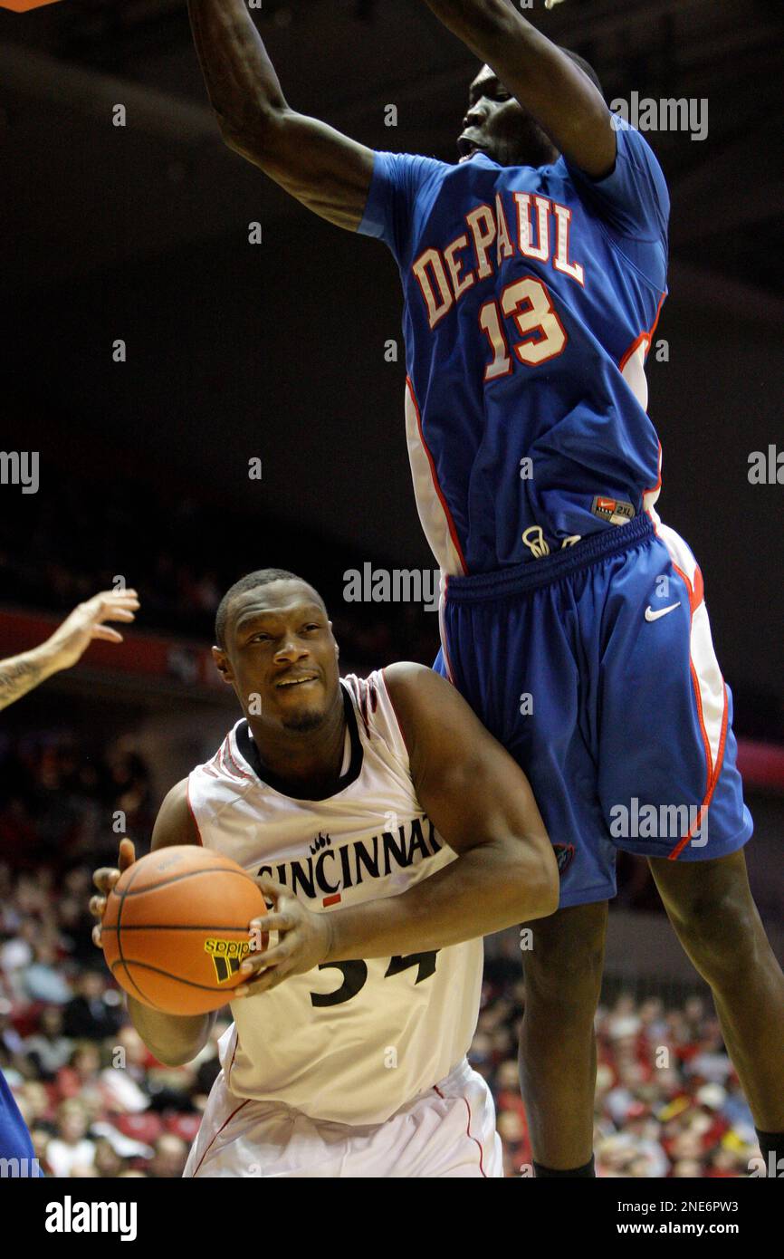 Cincinnati forward Yancy Gates (34) in action against DePaul forward ...