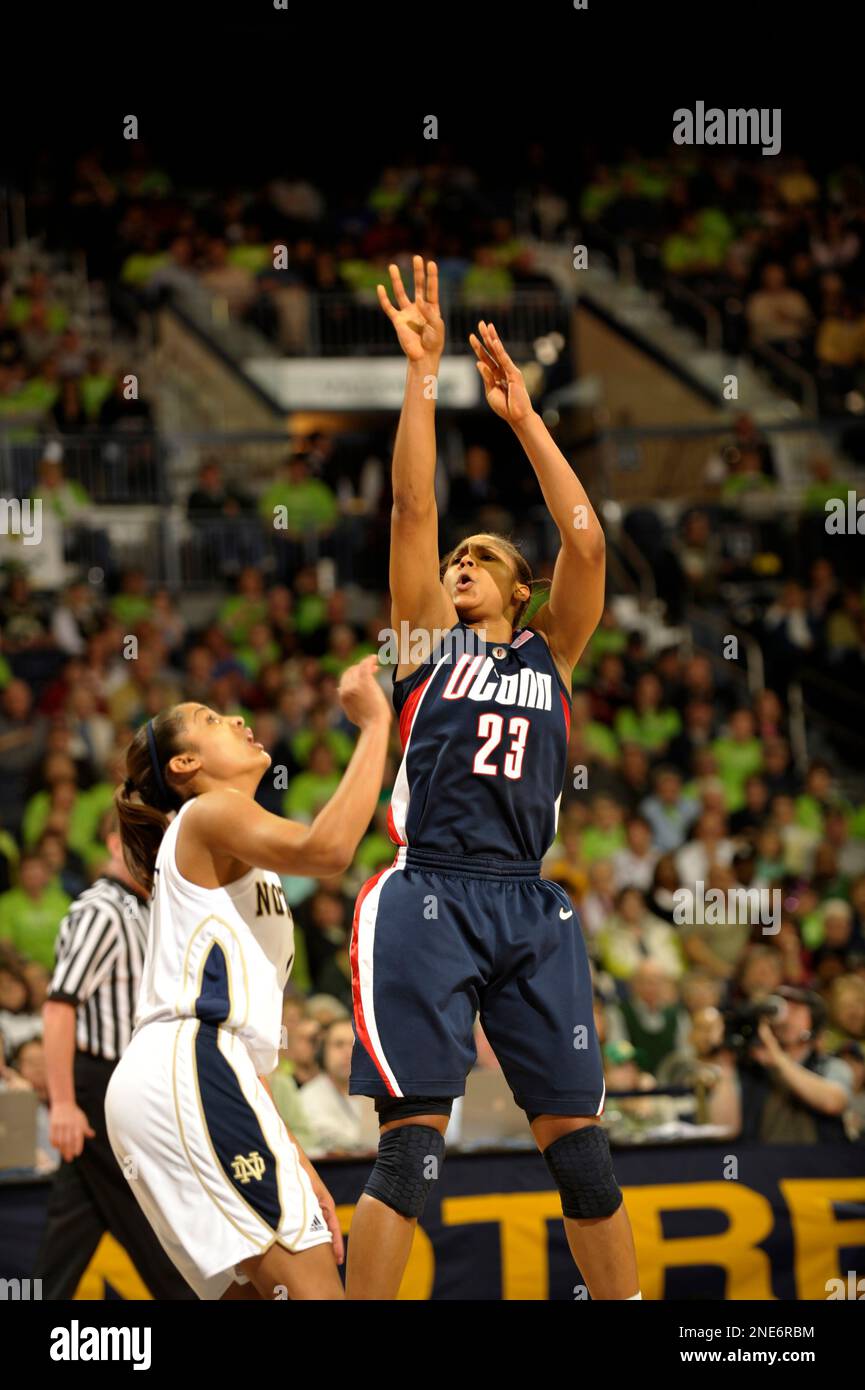 Connecticut guard Maya Moore puts up a shot over Notre Dame guard ...