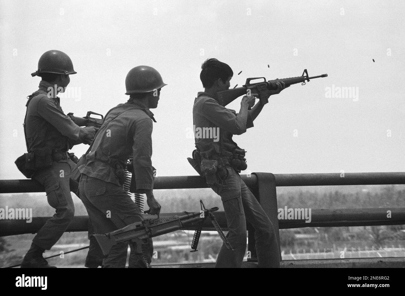 Spent shall casings fly from a South Vietnamese trooper?s R16 rifle as ...