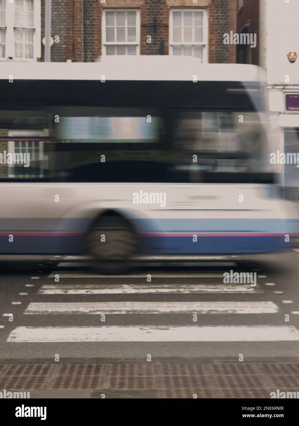 A vertical long exposure of a bus going over a crossing Stock Photo - Alamy