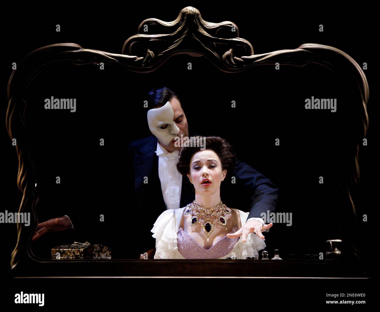 The Phantom, played by Ramin Karimloo, right, performs a scene with ...