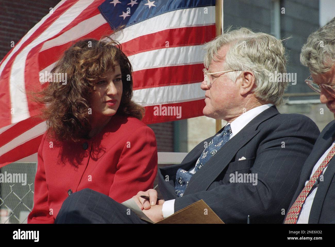 A flag flutters behind Victoria Reggie-Kennedy as her husband U.S ...