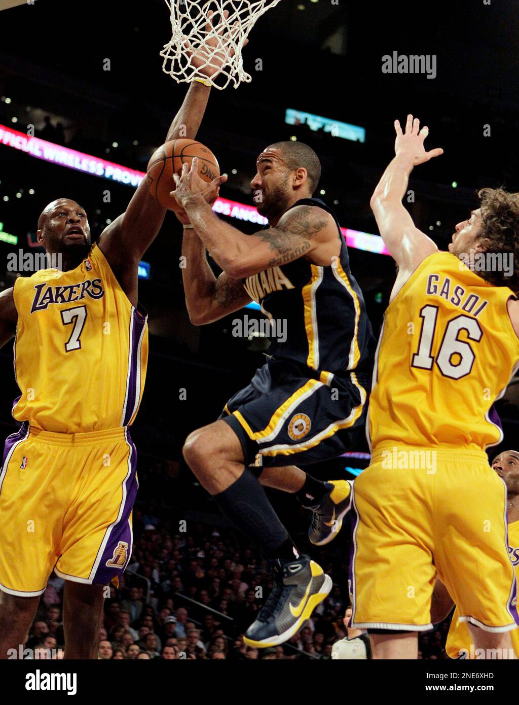 Indiana Pacers guard Dahntay Jones, center, goes up for a shot between ...