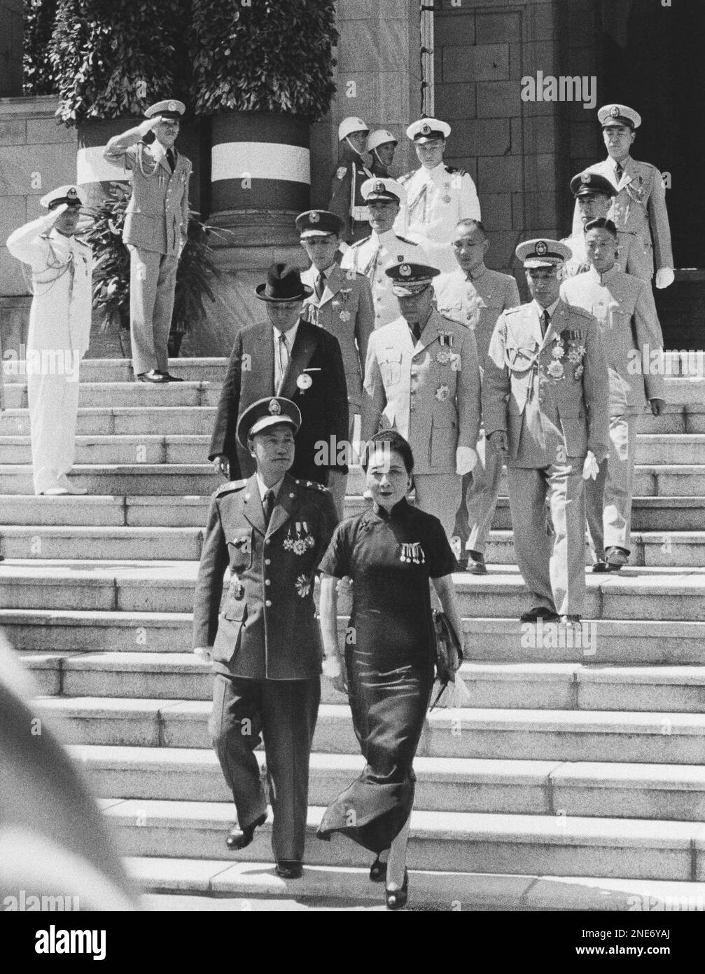 Generalissimo and Madame Chiang Kai-shek precede military officers down ...