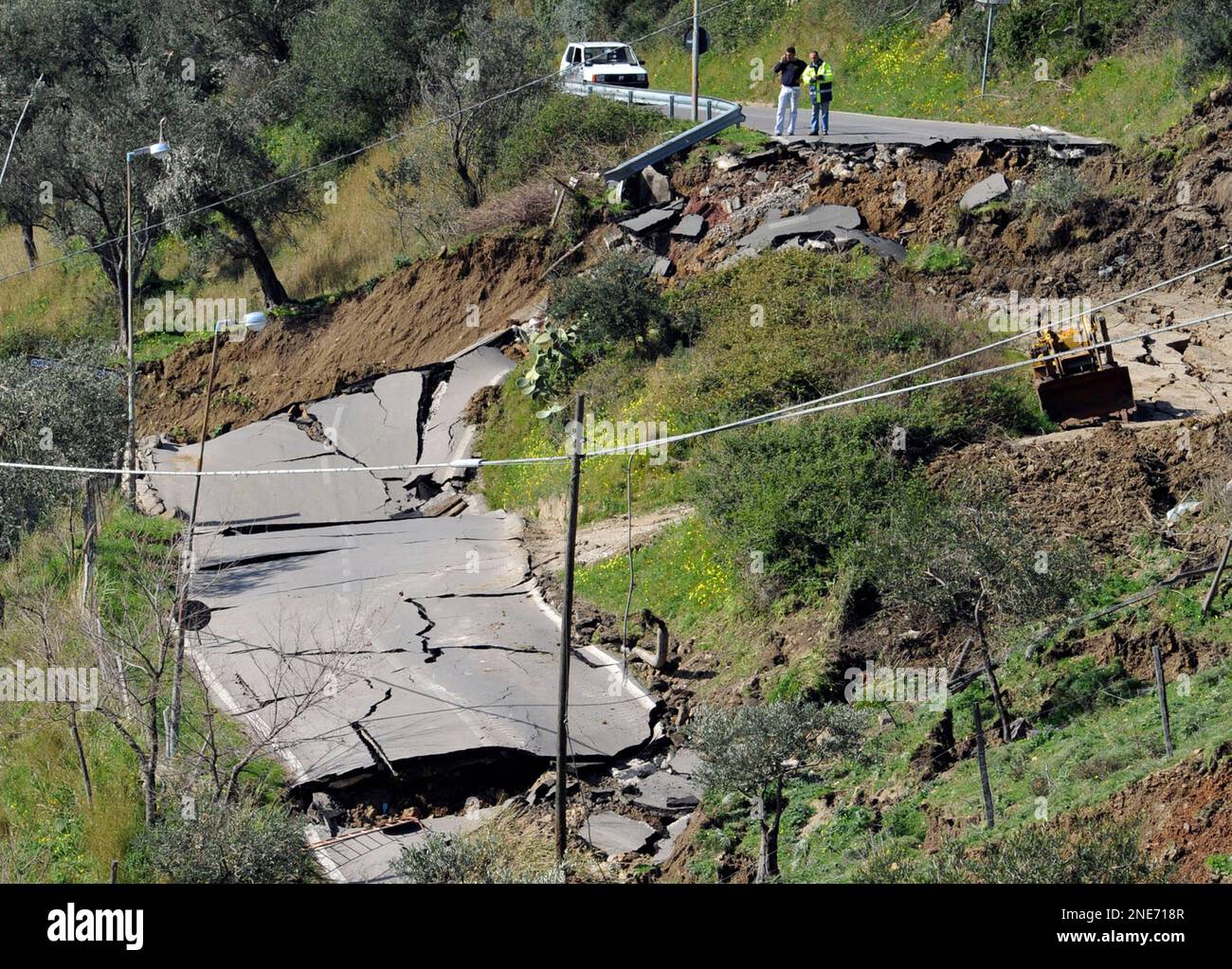 A collapsed road is seen in Caronia, near Messina, southern Italy ...