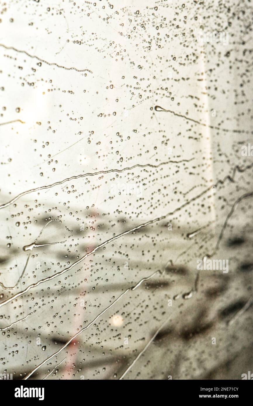 A vertical shot of a window with rain drops on it Stock Photo - Alamy