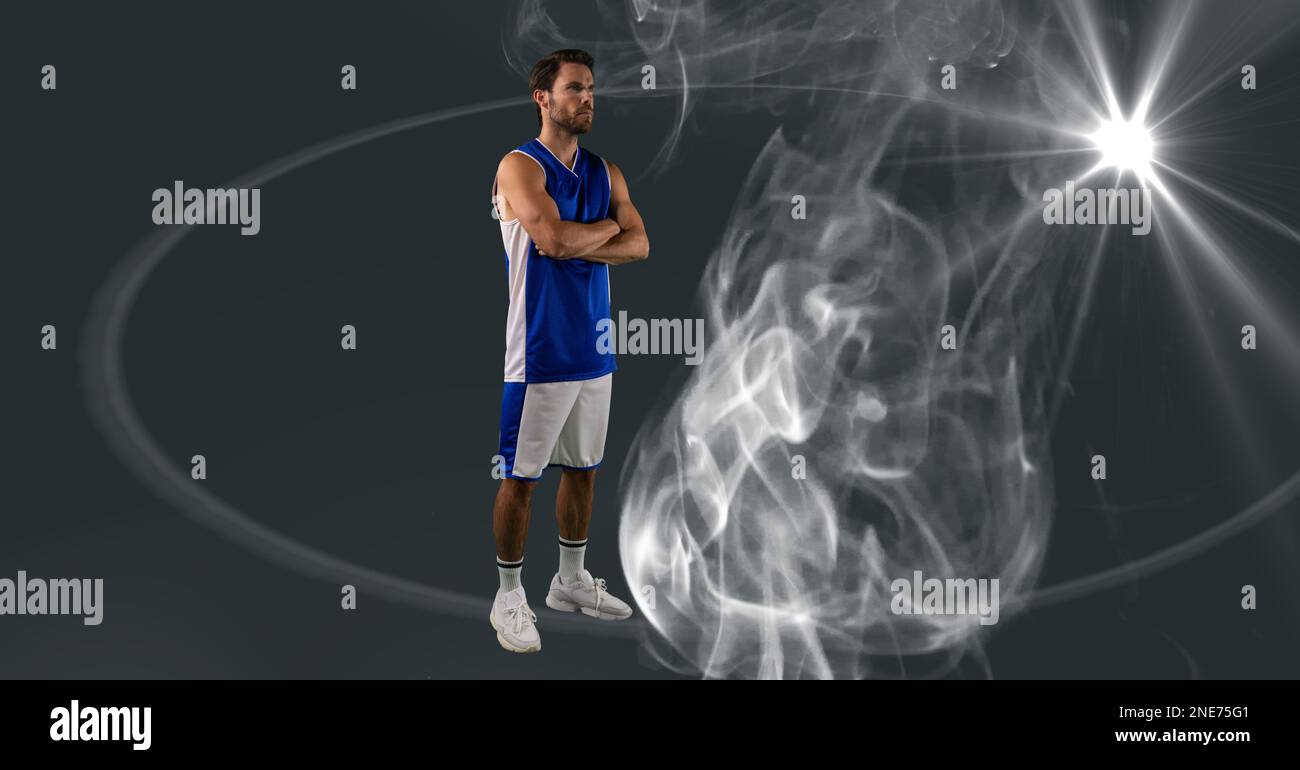Composition of male basketball player with arms crossed with copy space ...