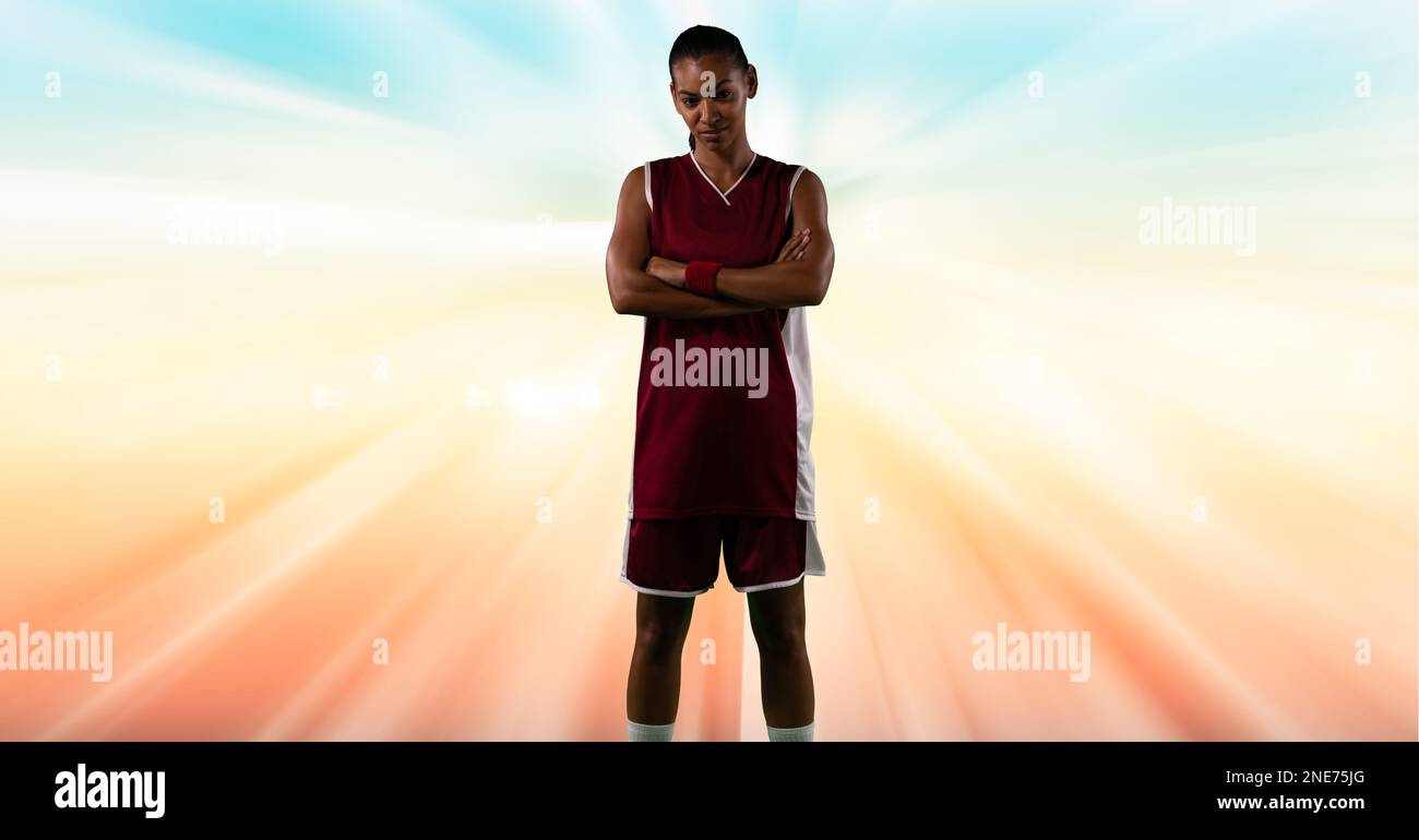 Composition of female basketball player with arms crossed with copy ...