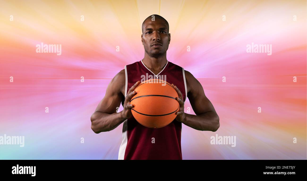 Composition of male basketball player holding basketball with copy ...