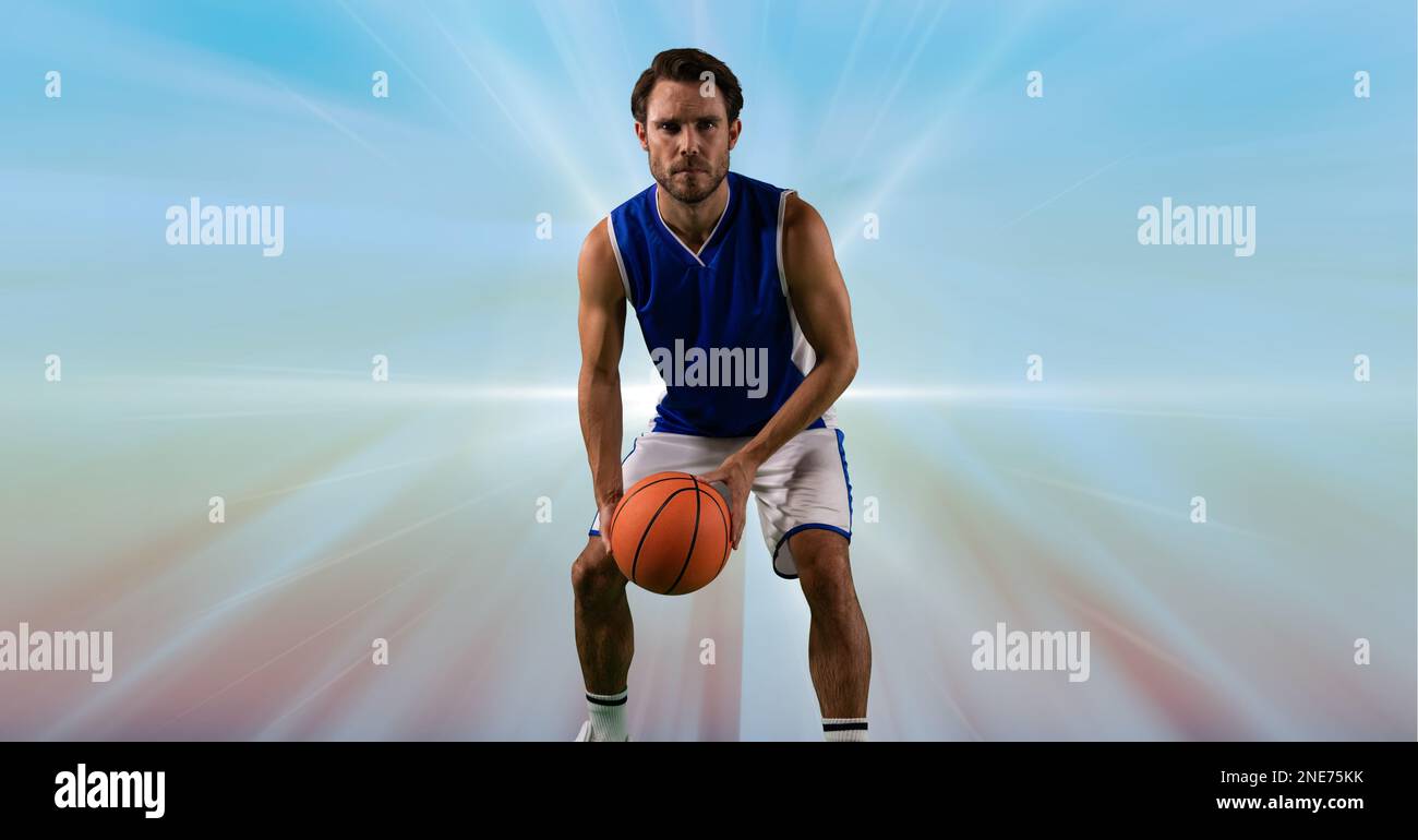 Composition of male basketball player holding basketball with copy ...