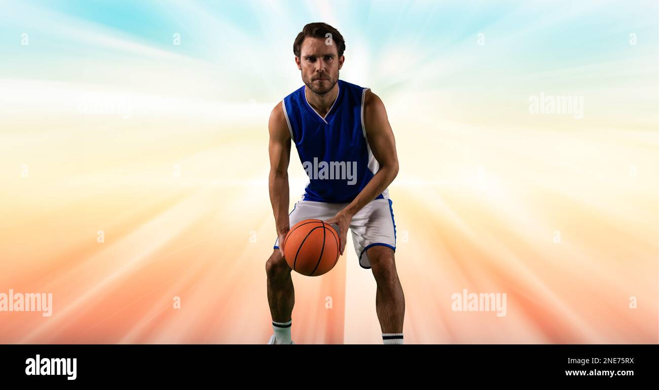 Composition of male basketball player holding basketball with copy ...