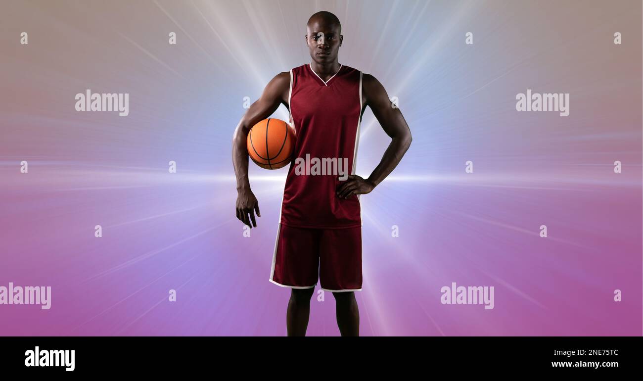 Composition of male basketball player holding basketball with copy ...