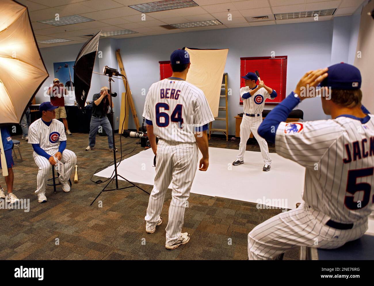 Chicago Cubs team photographer Steve Green, left, photographs Cubs' Sam ...