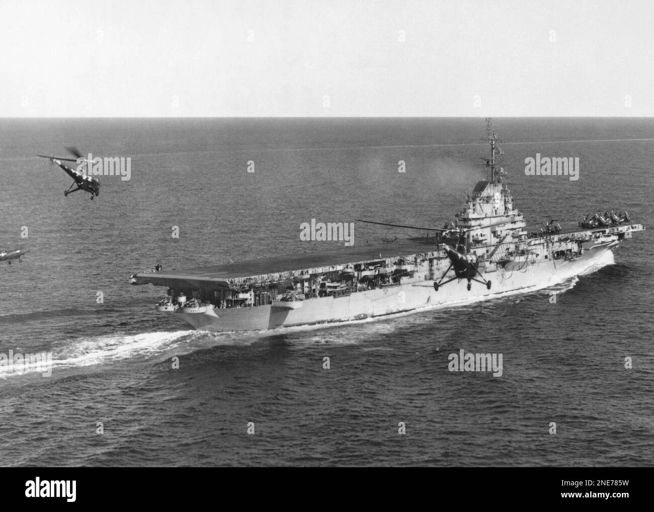 Helicopter Plane guard "stand by" as Corsair fighter aproaches USS ...
