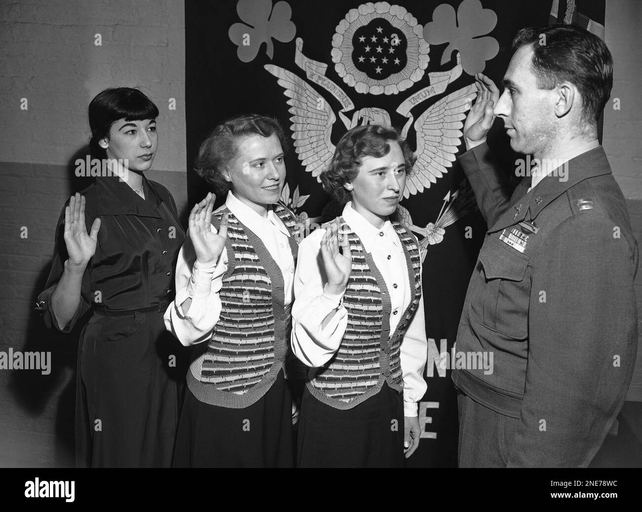 Three young New Yorkers raise their right hands as they are sworn into ...