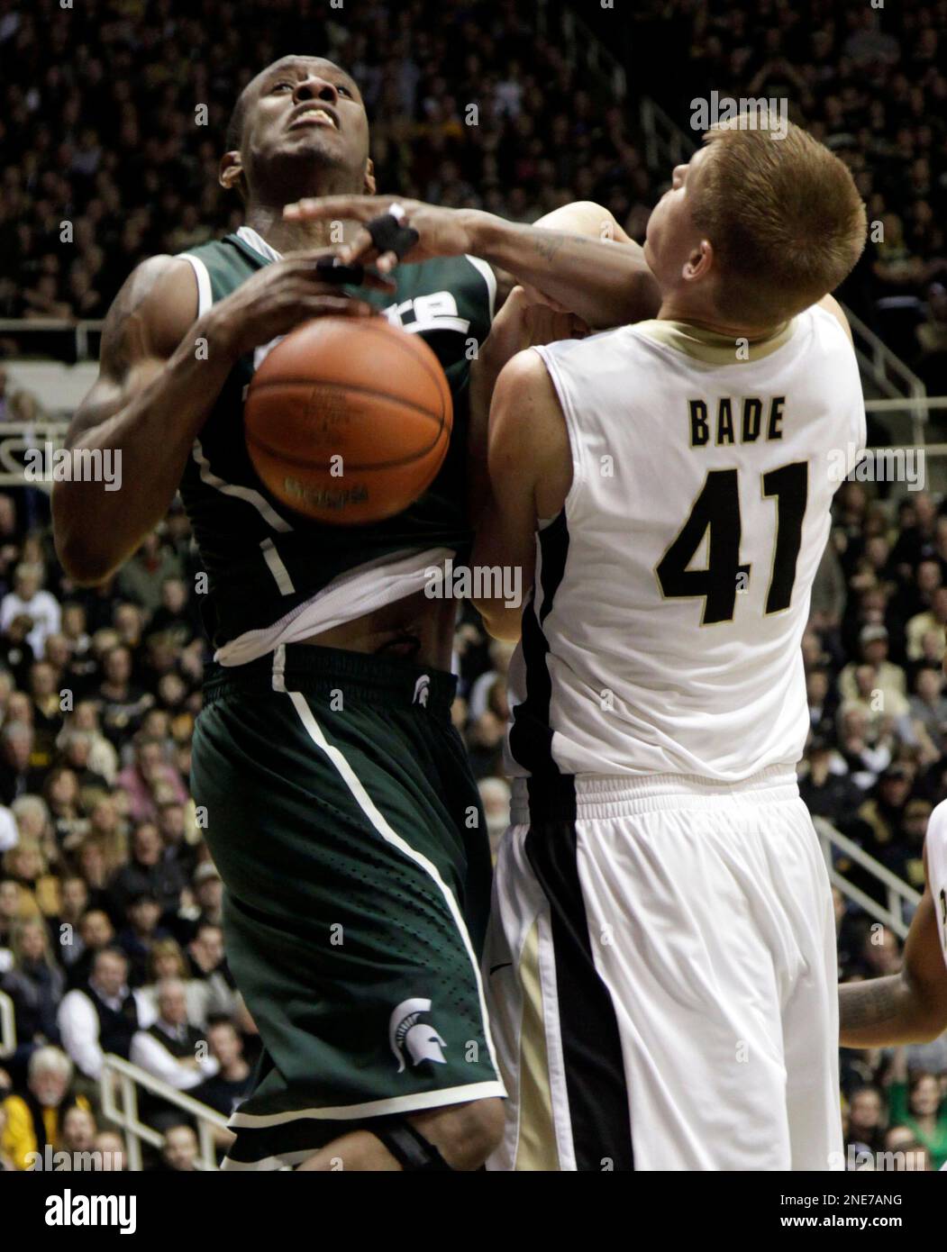 Michigan State forward Raymar Morgan, left, fights for a rebound with ...