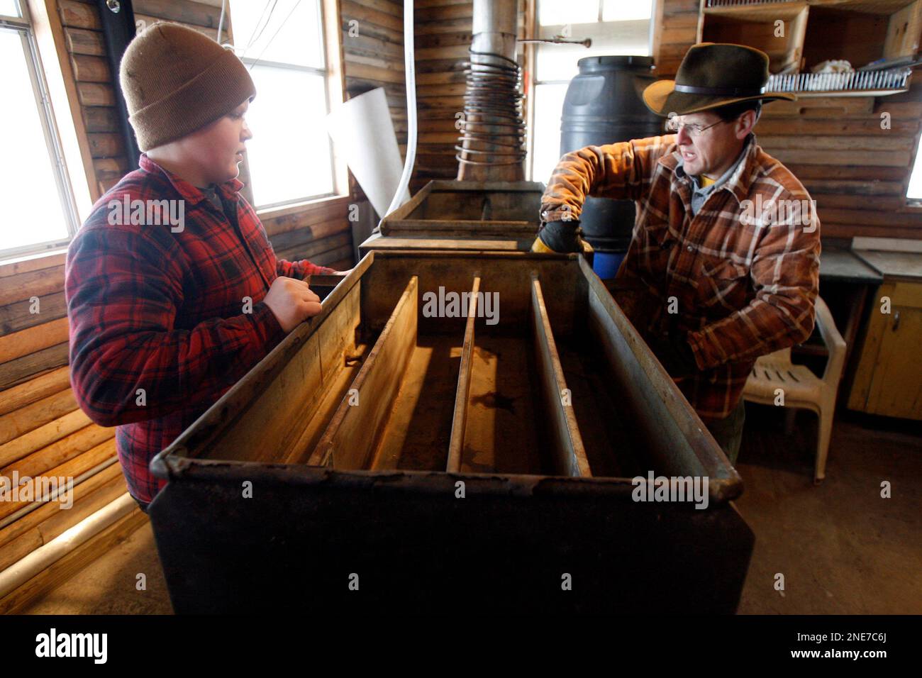 In this Feb. 25, 2010 photo Eric May, right, and his son, Darin ...