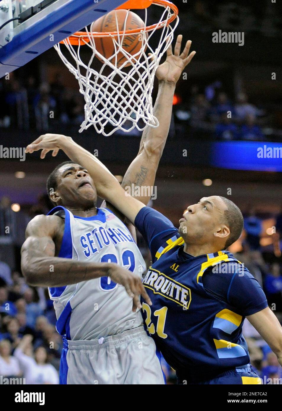 Seton Hall's Jeff Robinson, left, is fouled by Marquette's Joseph Fulce ...