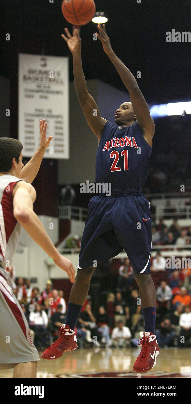 Arizona guard Kyle Fogg, right, shoots over Stanford forward Jack ...