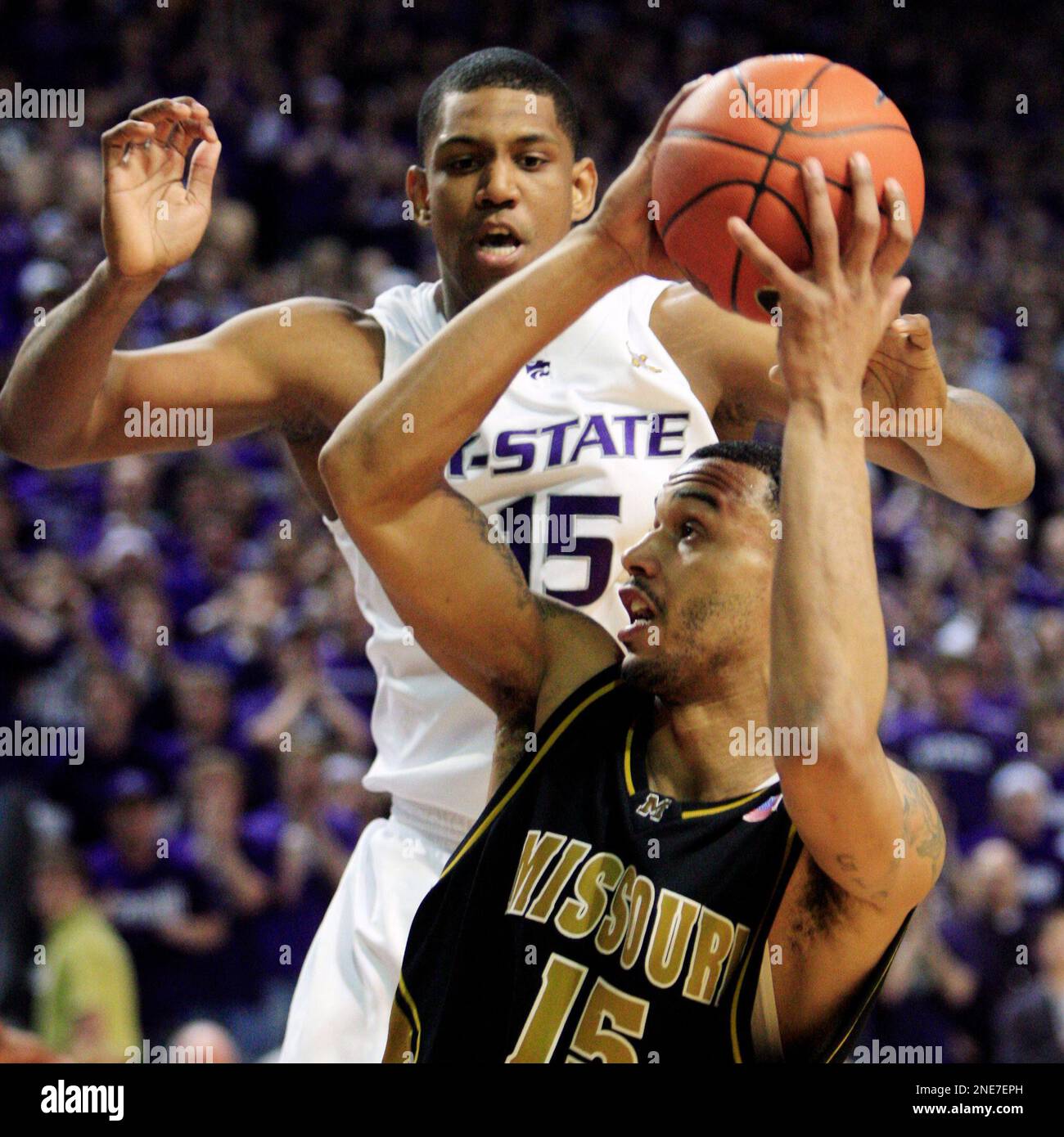 Missouri forward Keith Ramsey. foreground, prepares to shoot over ...