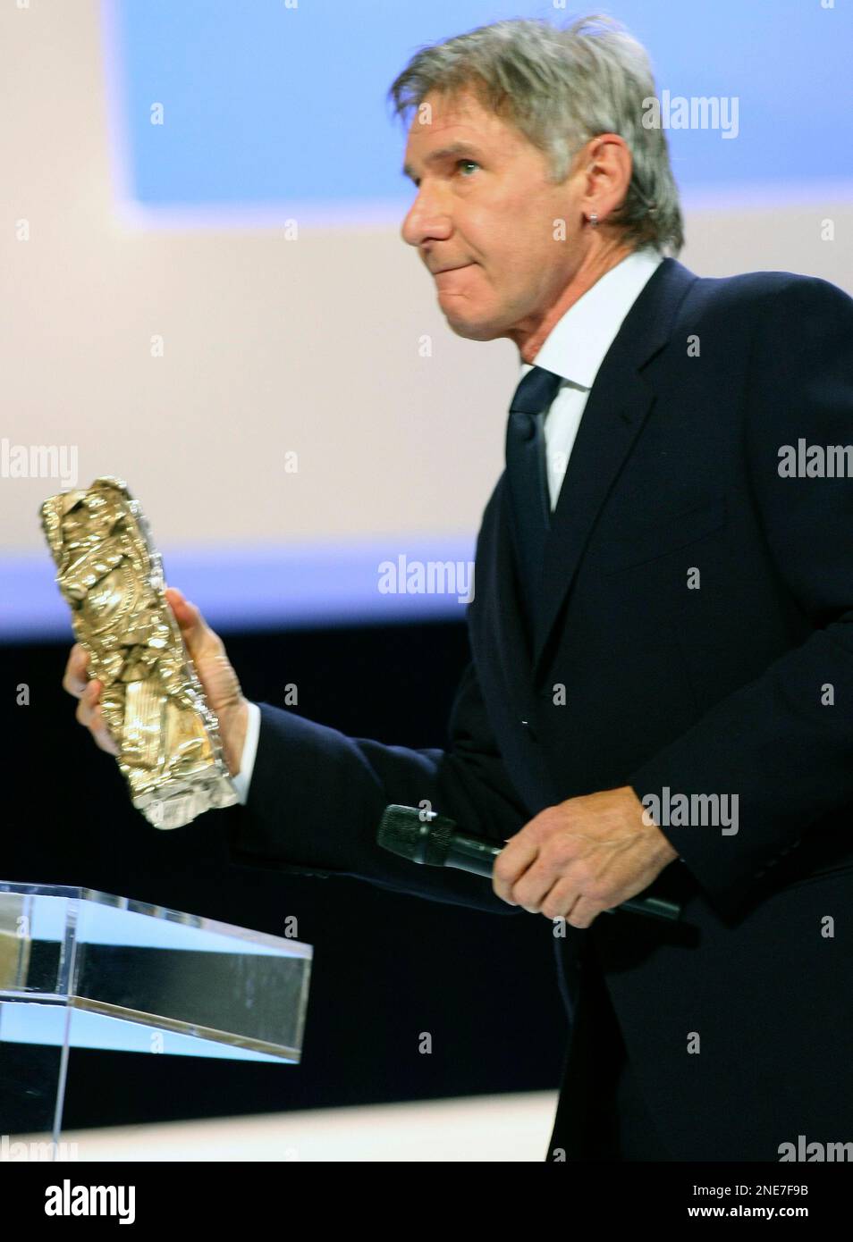 U.S actor Harrison Ford holds his trophy after receiving a Cesar award ...