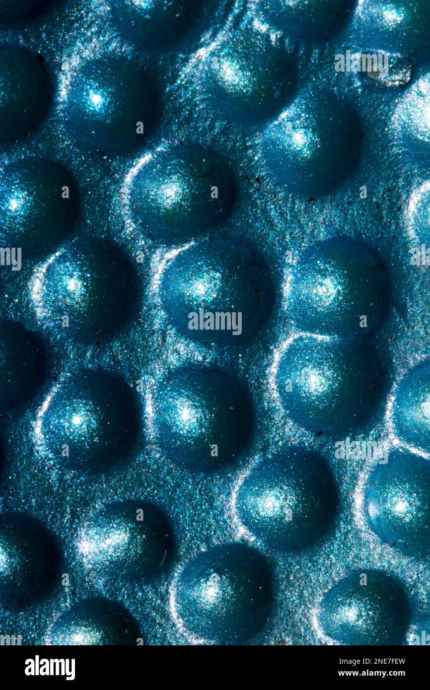 A Alien trypophobia holes in a shiny sci-fi close up background Stock ...