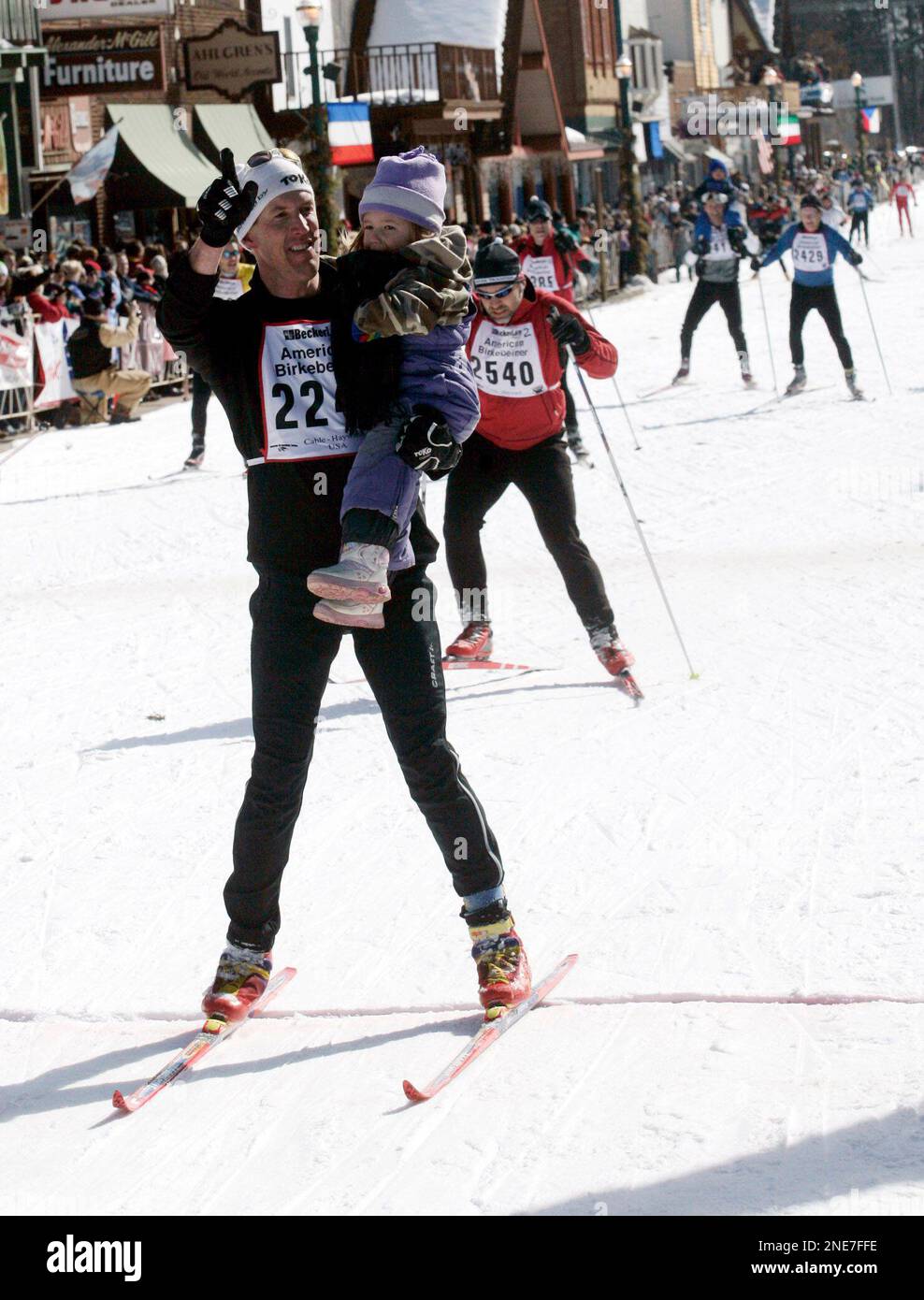 Matt Zuzek, and his daughter Ala Zuzek, 3, of Rice Lake, Wis., cross ...