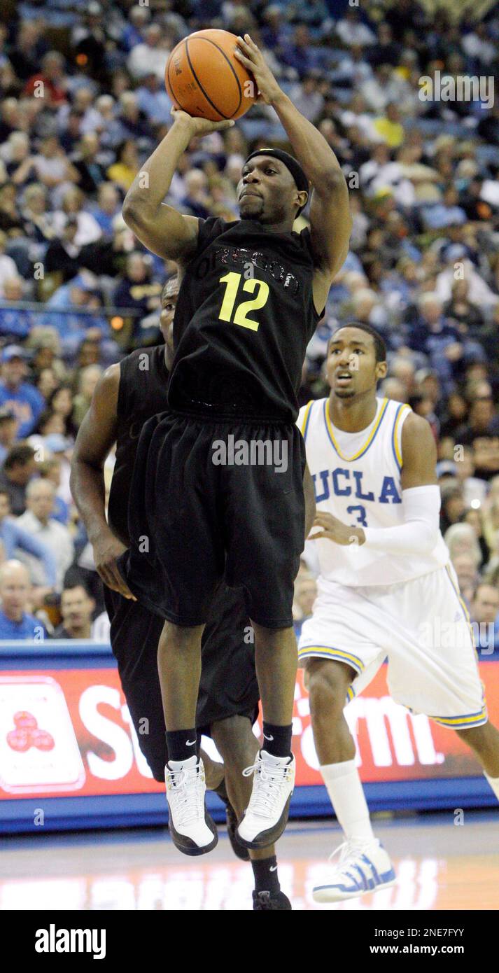 Oregon guard Tajuan Porter (12) puts up a three-point shot past UCLA ...