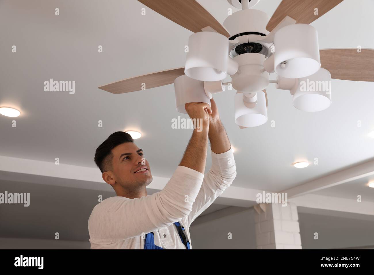 Male technician changing light hi-res stock photography and images - Alamy