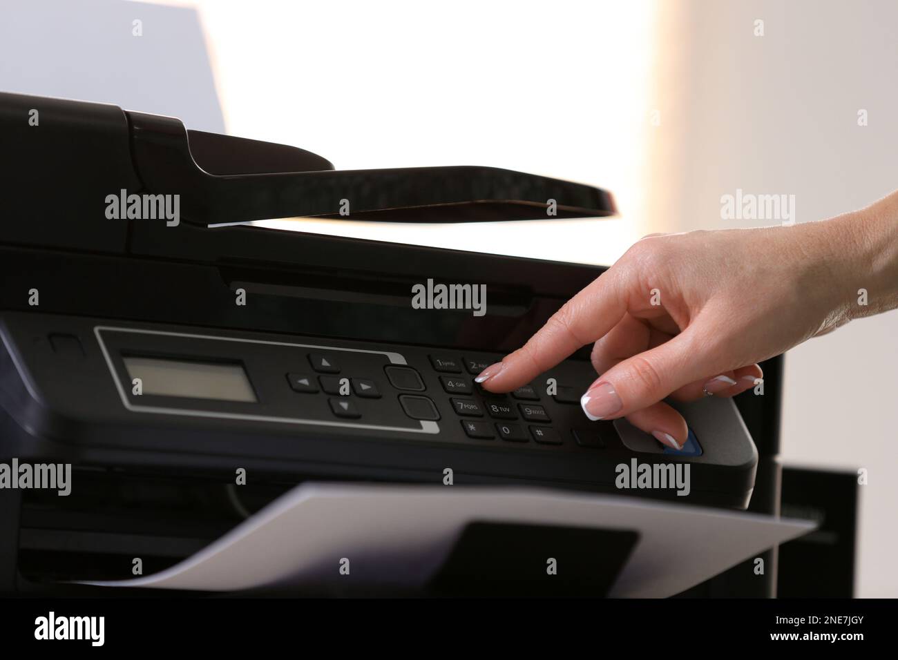 Person using multifunction printer hi-res stock photography and images ...
