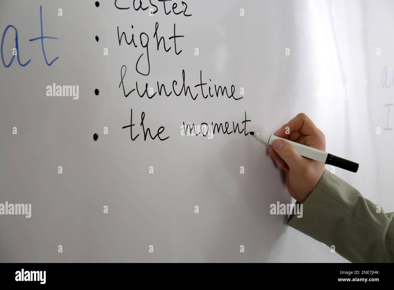 English teacher giving lesson near whiteboard, closeup Stock Photo - Alamy