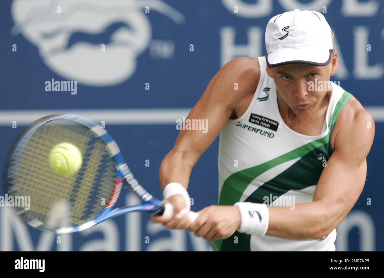 Sybille Bammer of Austria returns the ball to Elena Dementieva of ...