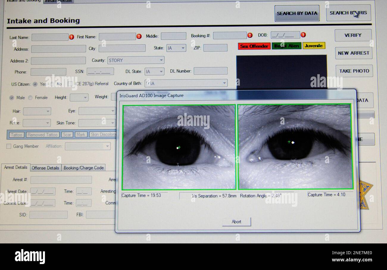 Scans of an inmate's eyes appear on a computer monitor attached to the ...