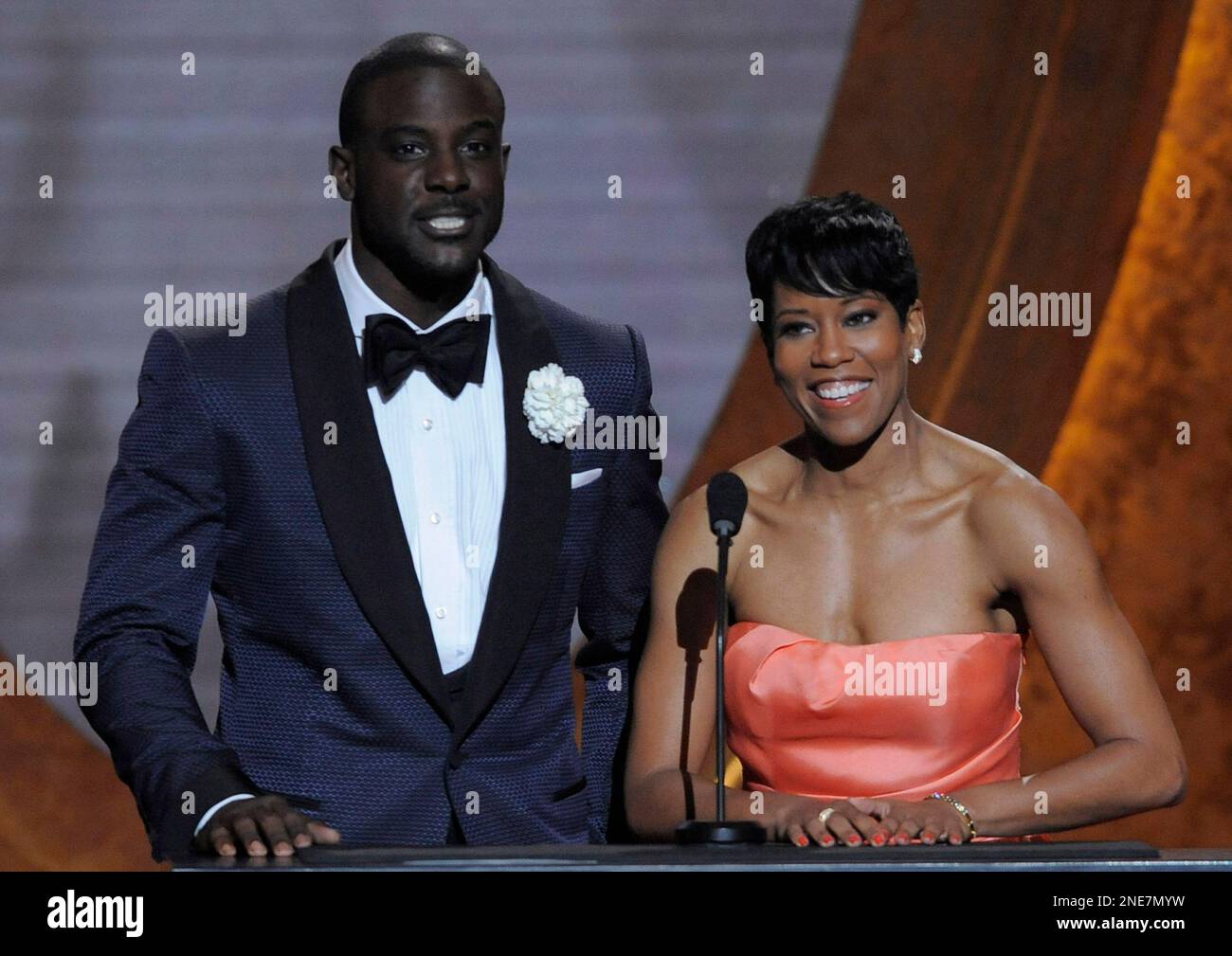 Lance Gross, left, and Regina King present an award at the 41st NAACP ...
